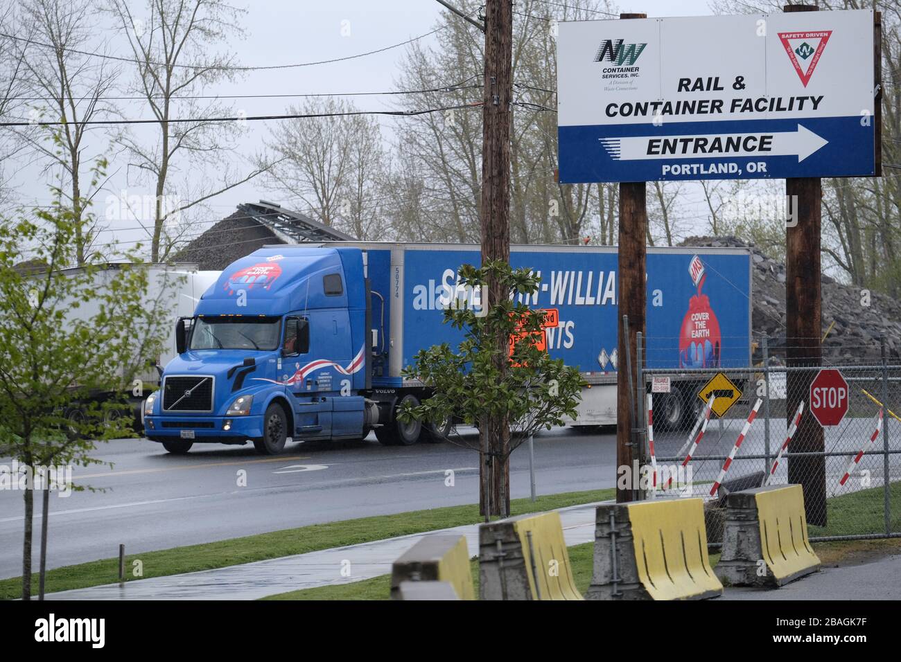 Portland, USA. 27th Mar, 2020. A Sherwin Williams truck drives past the ...