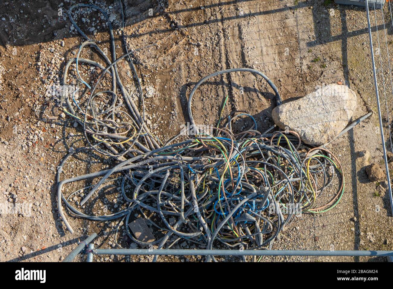 on a large construction site a lot of electric cables were dug out of ...