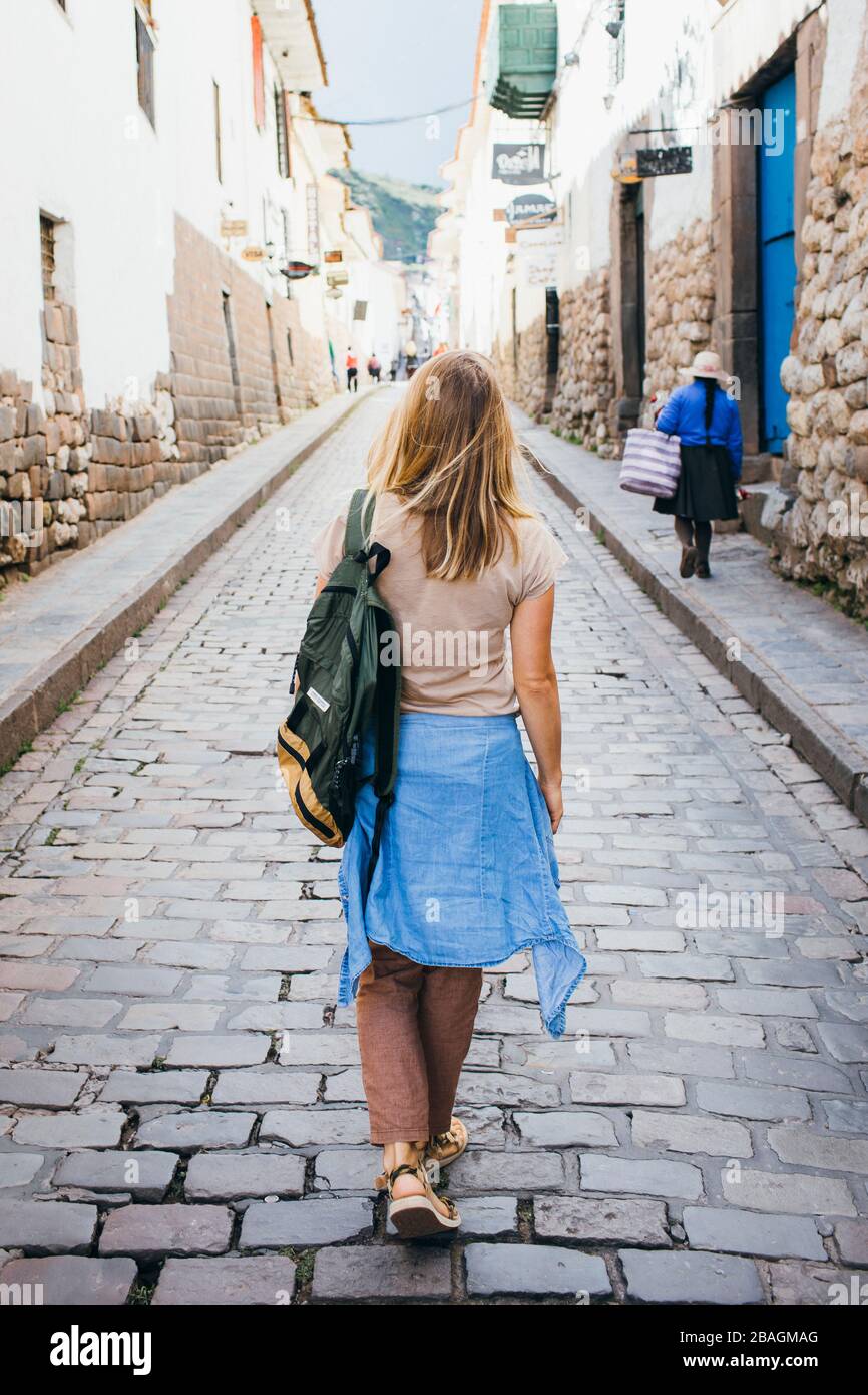 Woman back view walking street hi-res stock photography and images - Alamy
