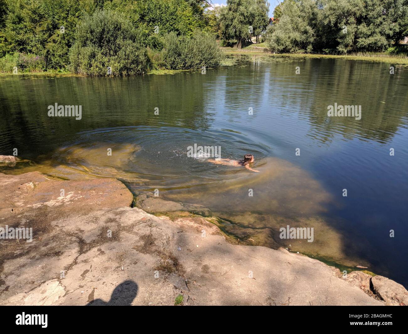 Girl at pond hi-res stock photography and images - Alamy