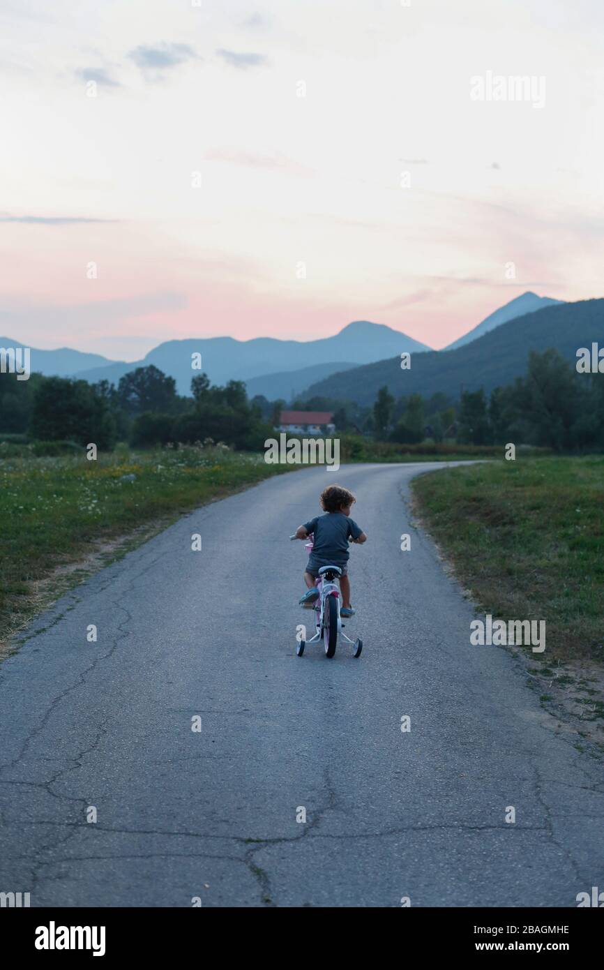 Boy riding his bicycle hi-res stock photography and images - Alamy