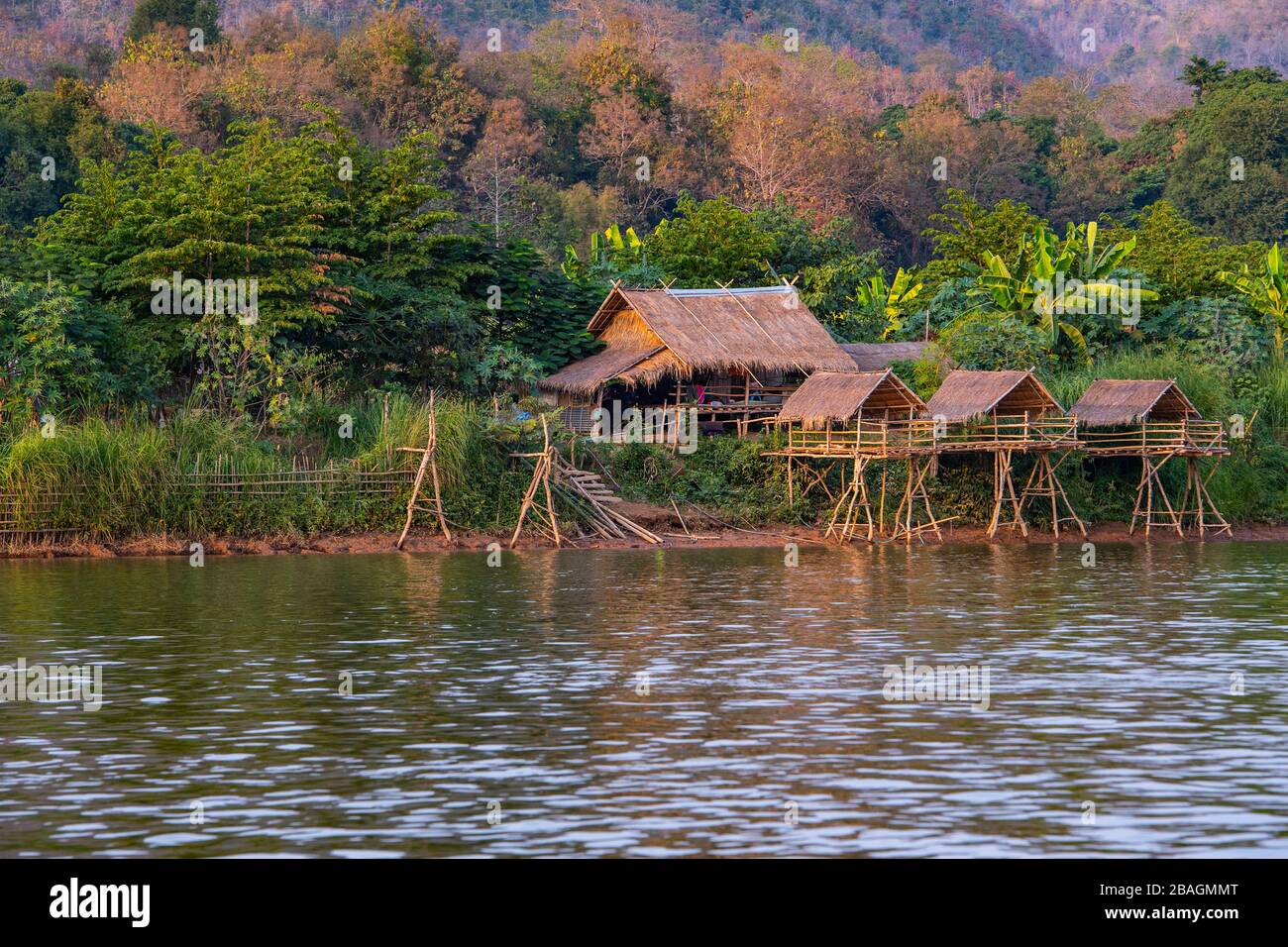 simple house along the Mekong River in Laos Stock Photo - Alamy