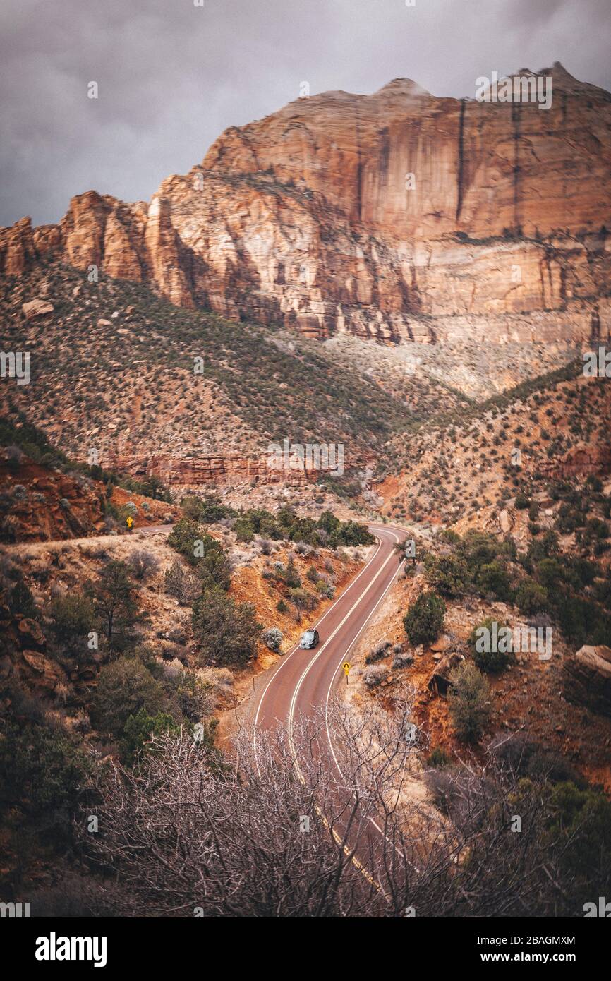 A road between mountains in Zion National Park, Utah Stock Photo - Alamy