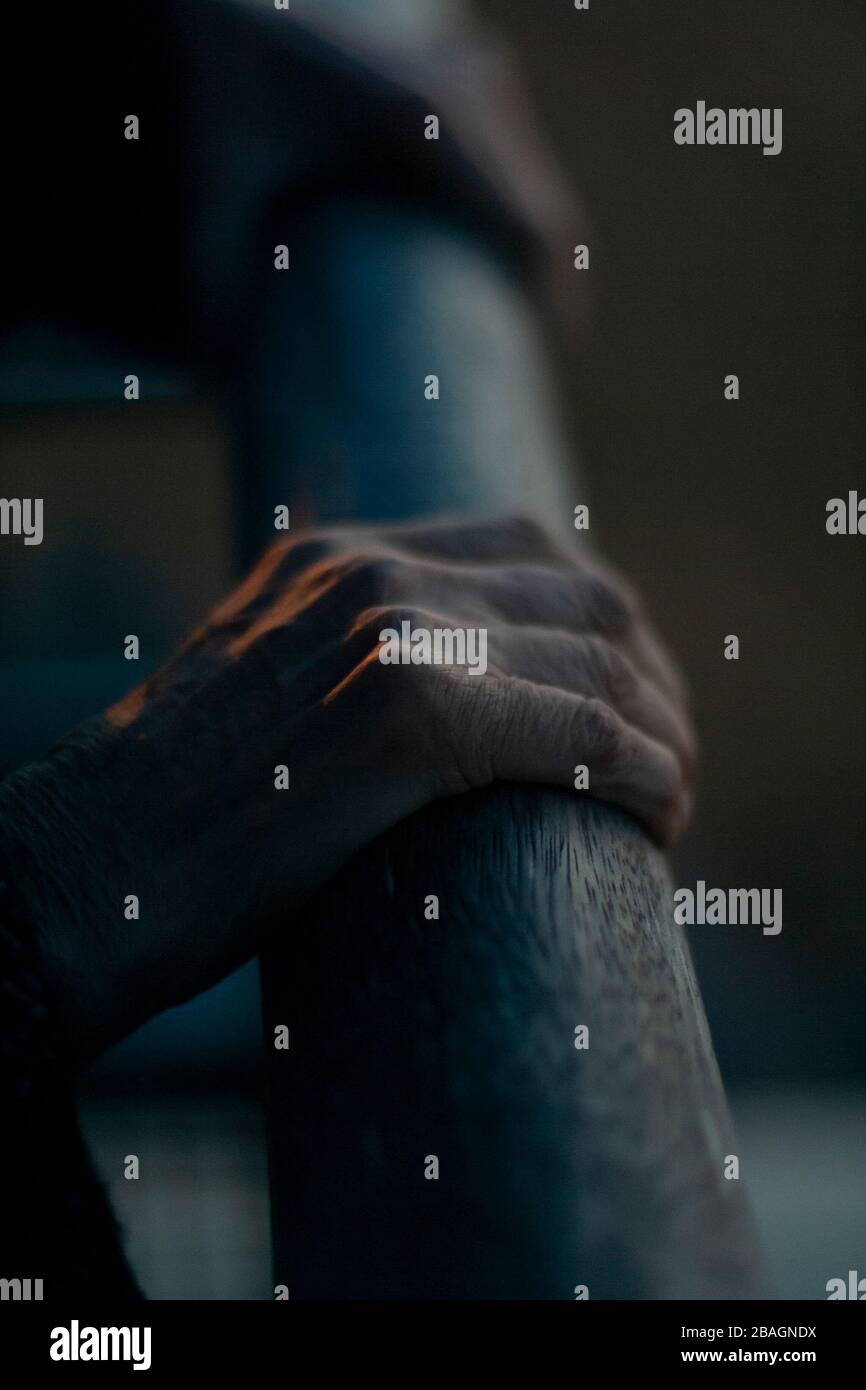 Fragile slim hands of an old lady with Alzheimer's disease, holing on ...