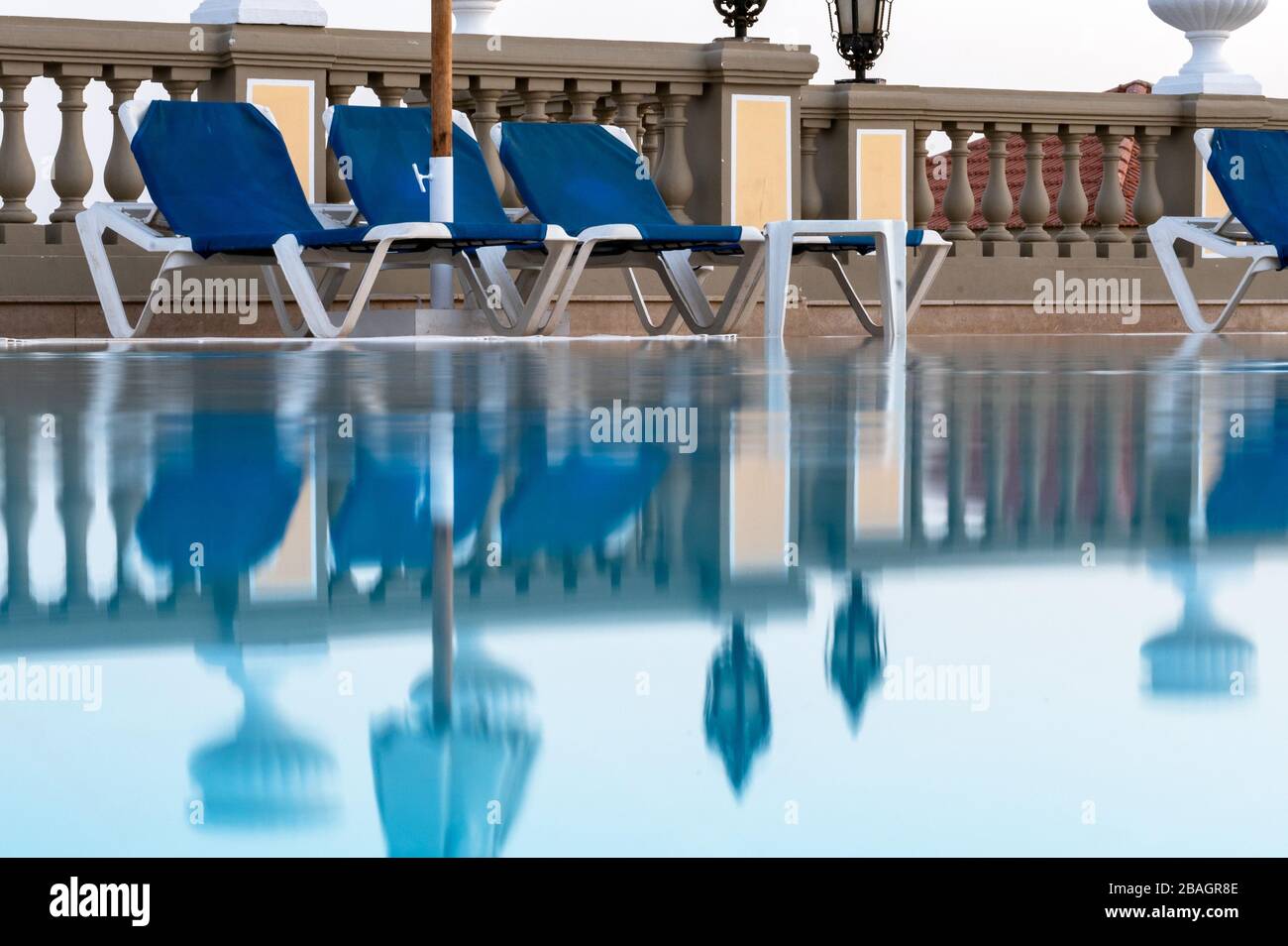 empty loungers in the hotel resort Stock Photo - Alamy