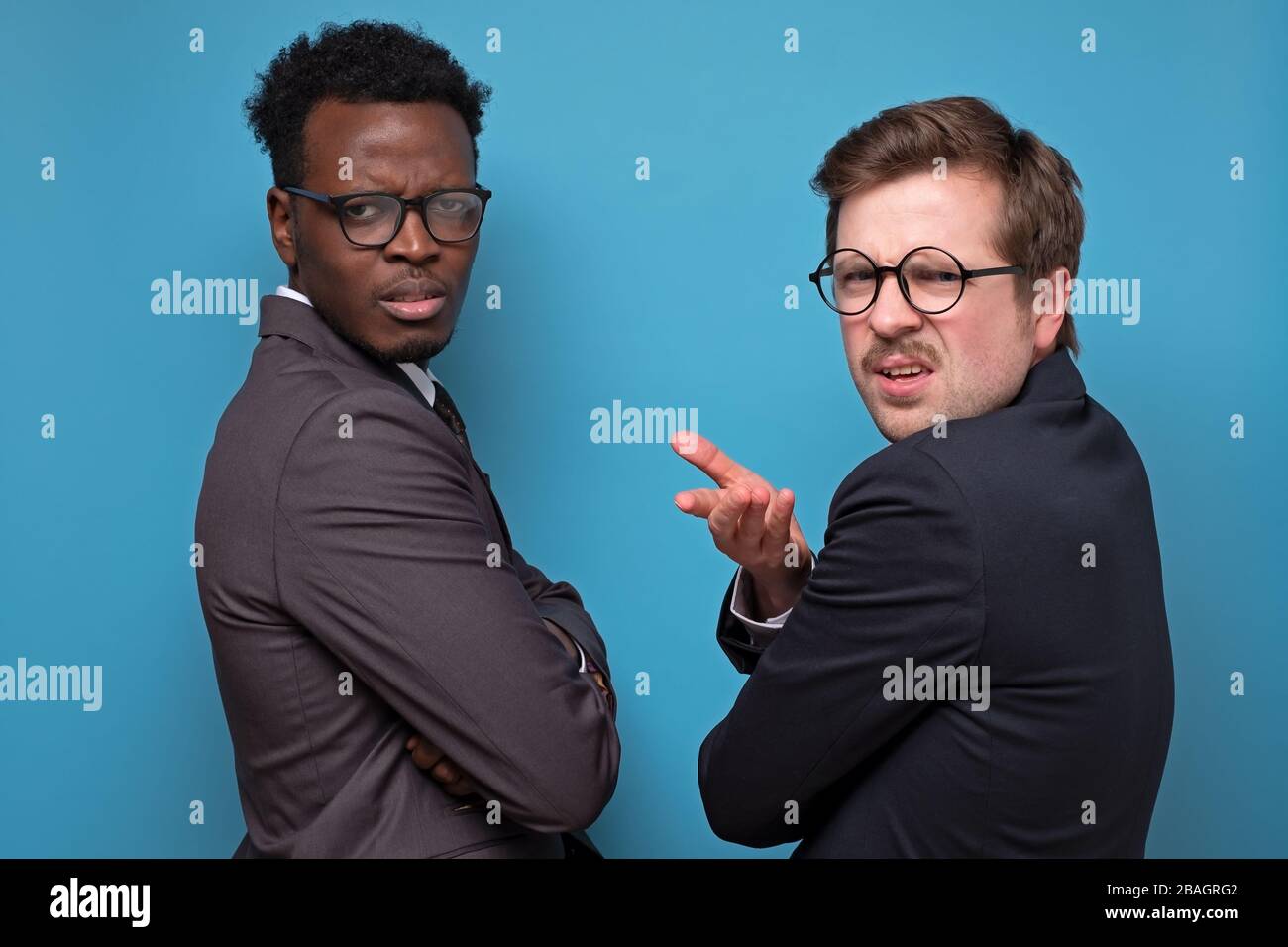 Two men having complain, arguing with business partner. Displeased and ...