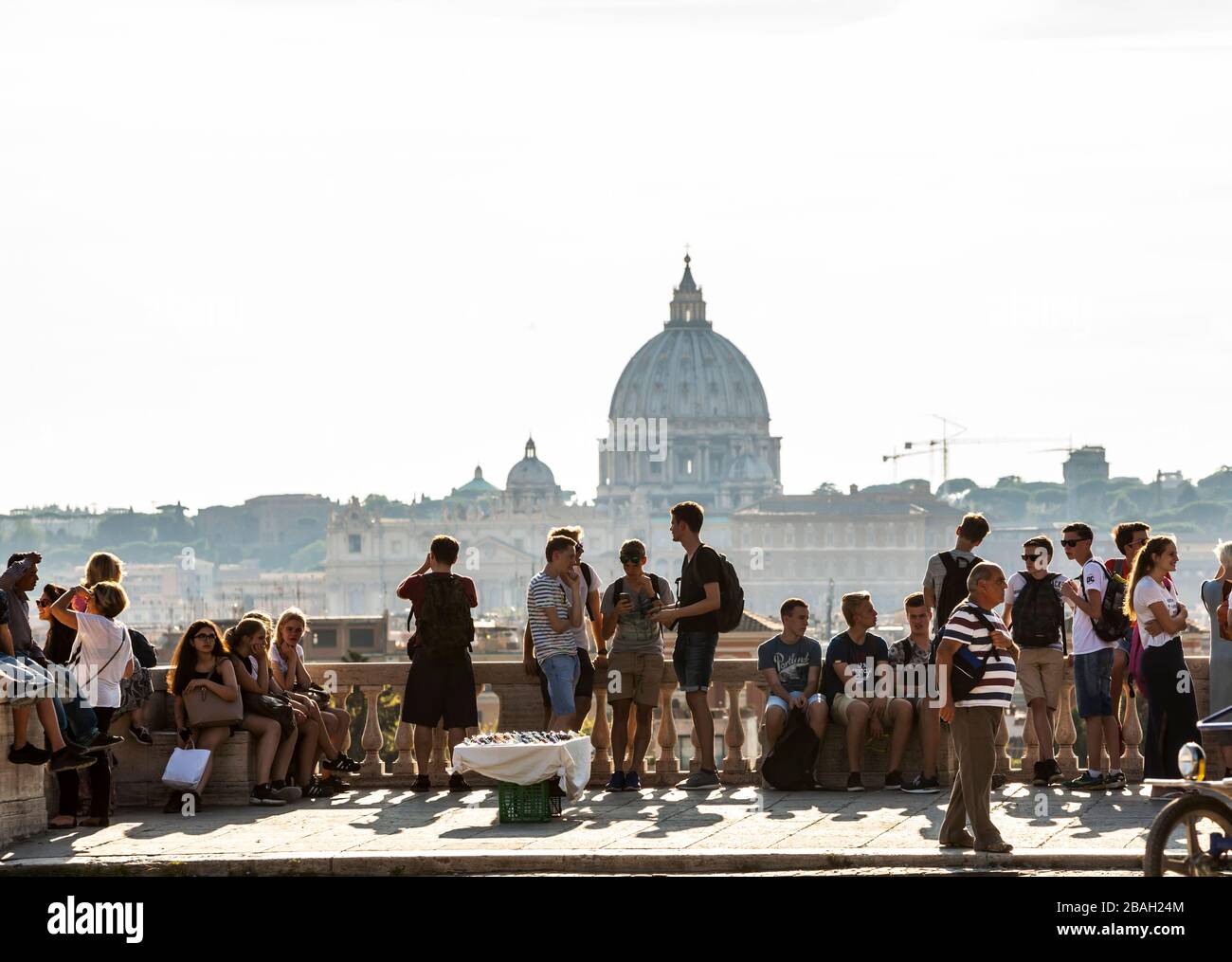 Tourists in Borghese Park overlooking Rome with St Peters Basilica in ...