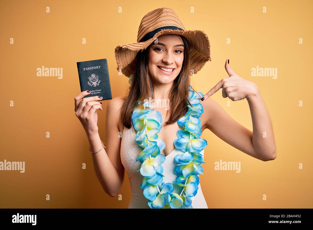 Young beautiful tourist woman on vacation wearing swimsuit and hawaiian ...