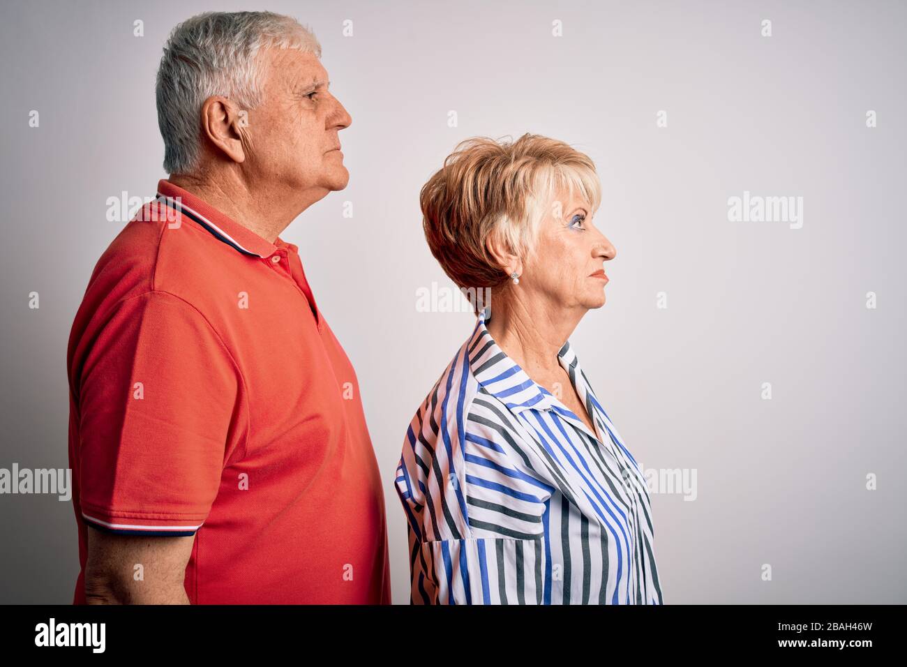 Senior beautiful couple standing together over isolated white ...