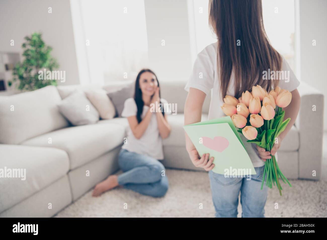 Photo of pretty funny little girl hiding behind back young charming ...