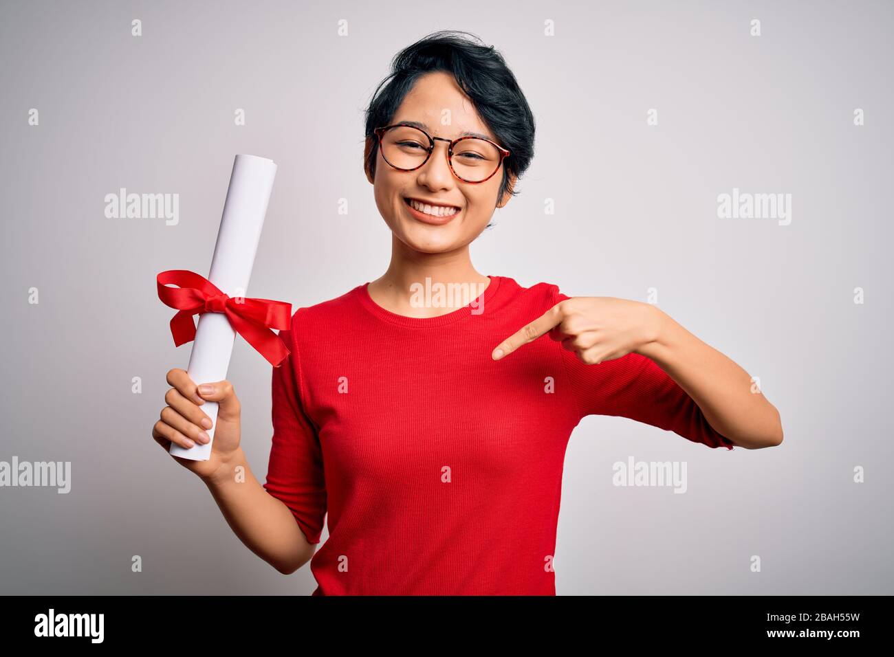 Beautiful chinese student woman wearing glasses holding university ...