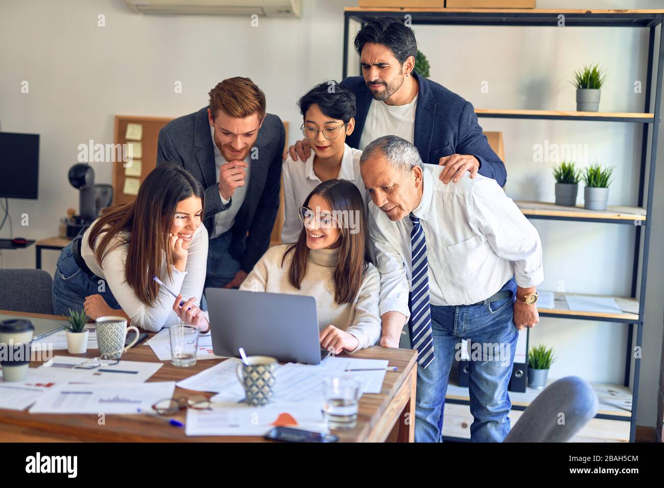 Group of business workers smiling happy and confident. One of them ...