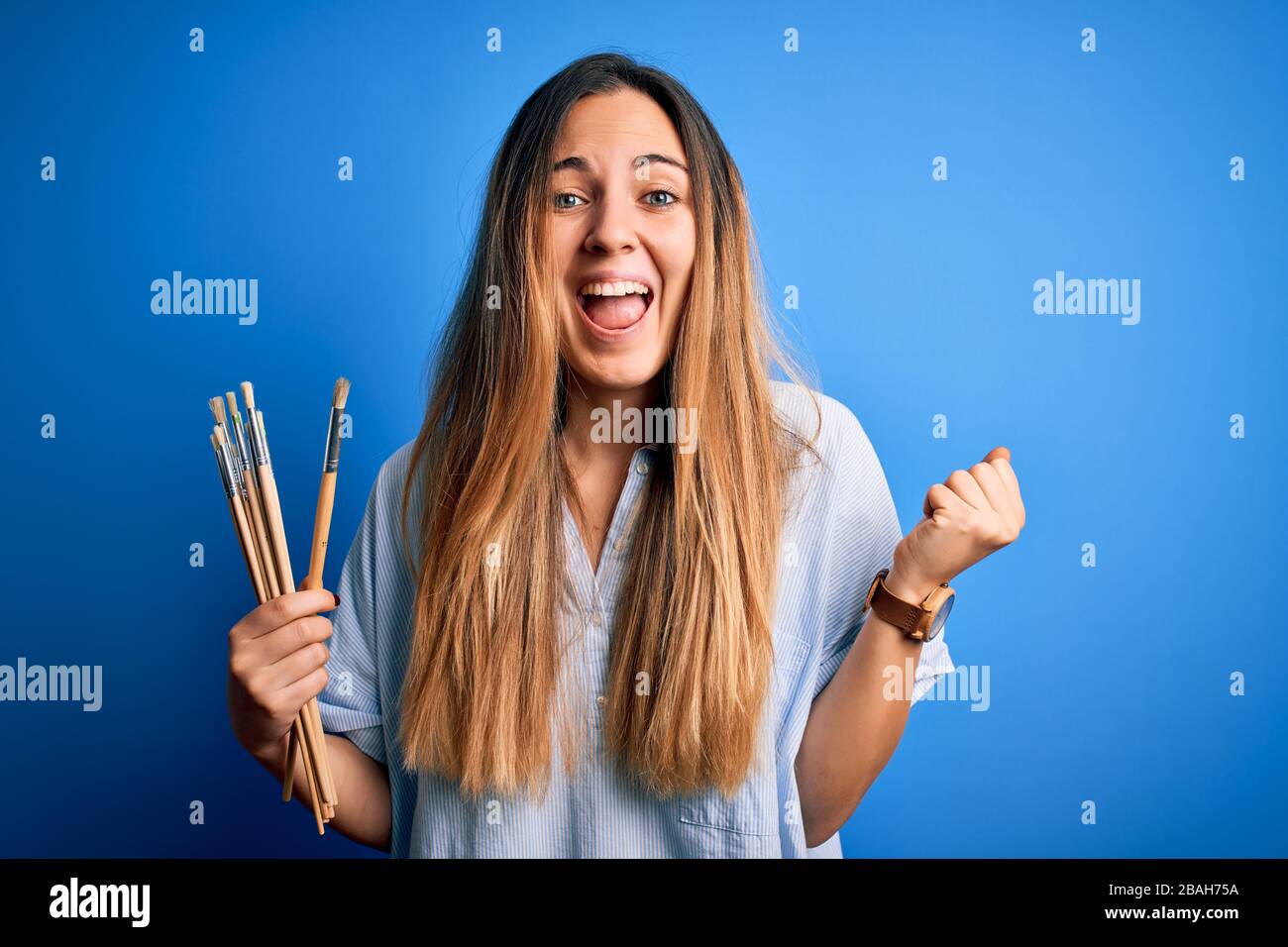 Excited young blonde artist hi-res stock photography and images - Alamy