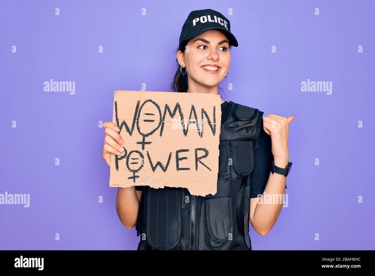Police woman wearing security bulletproof vest uniform holding woman ...