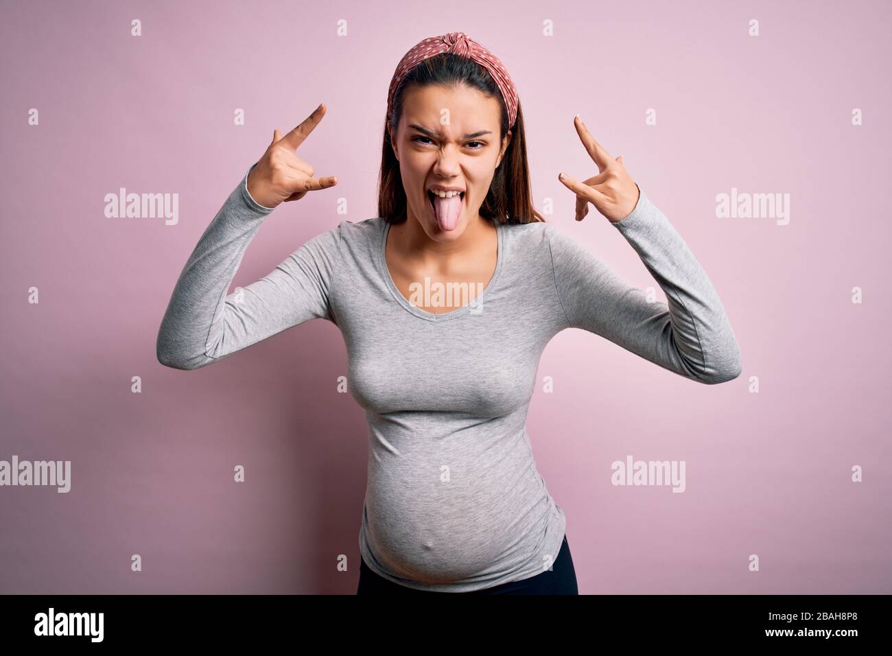 Young beautiful teenager girl pregnant expecting baby over isolated ...