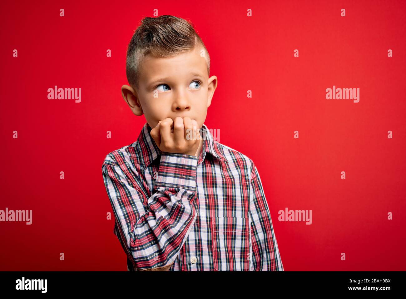 Young little caucasian kid with blue eyes standing wearing elegant ...