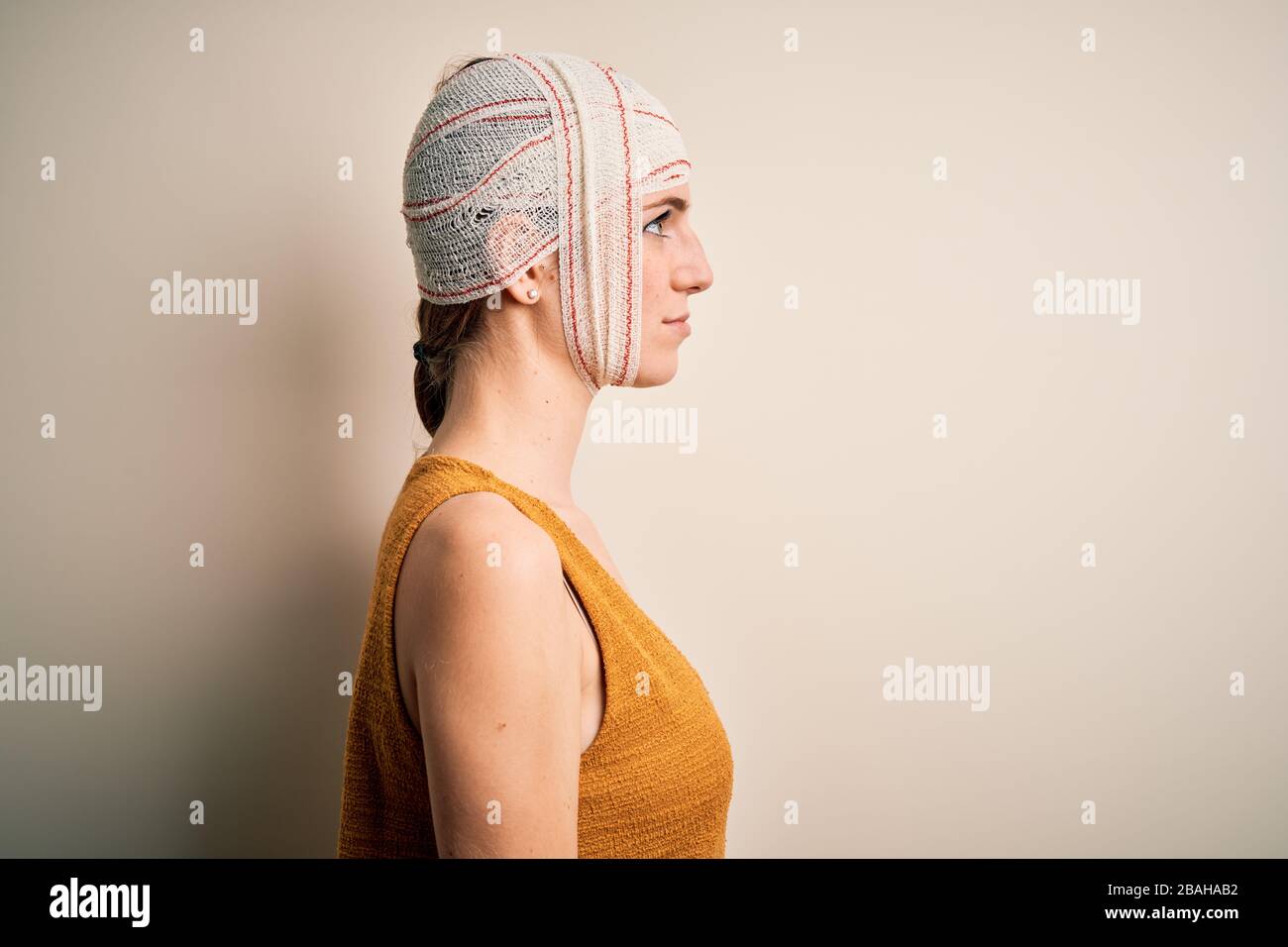 Young beautiful redhead woman injured for accident wearing bandage on ...