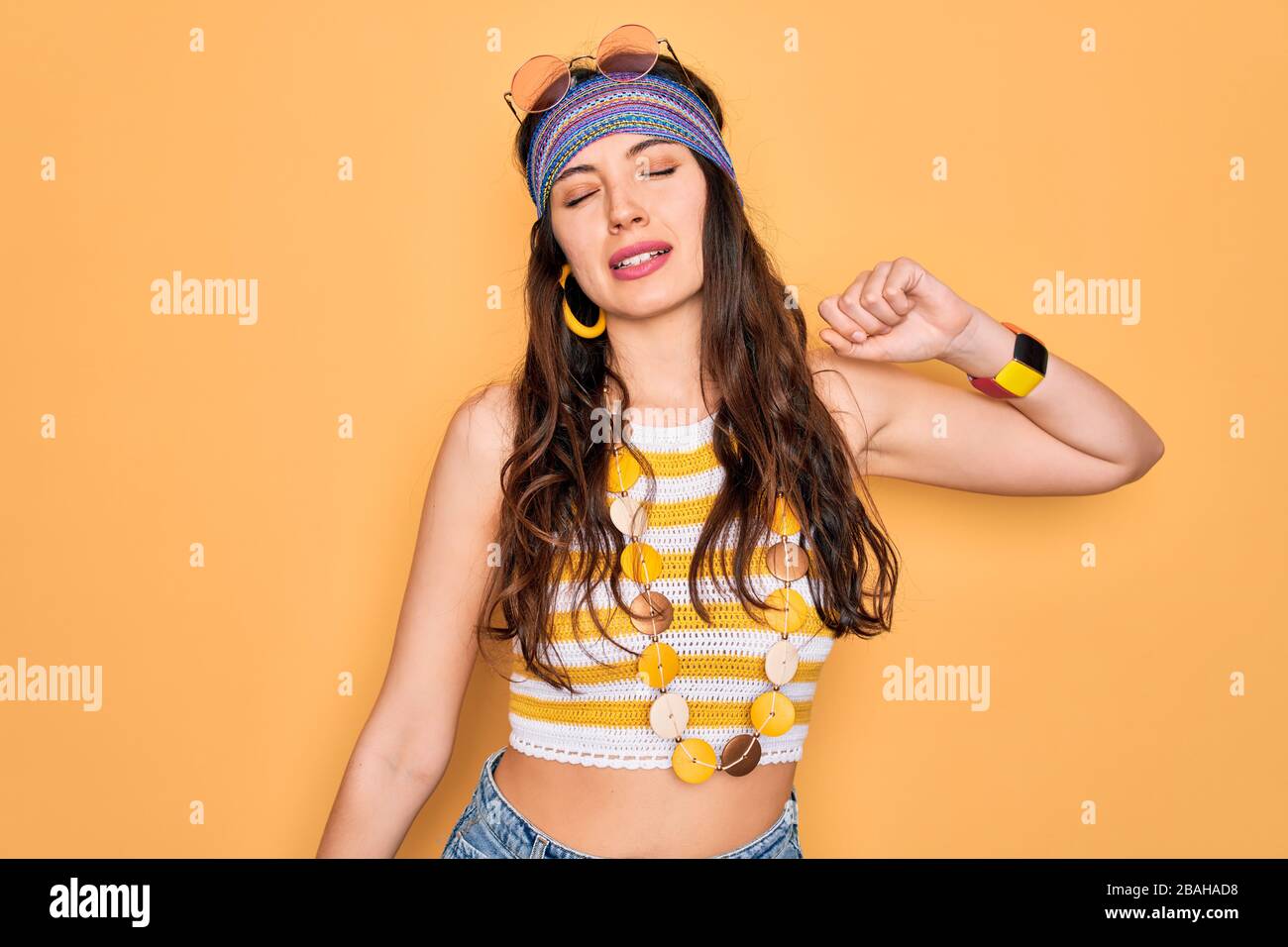 Young beautiful hippie woman with blue eyes wearing accesories and ...