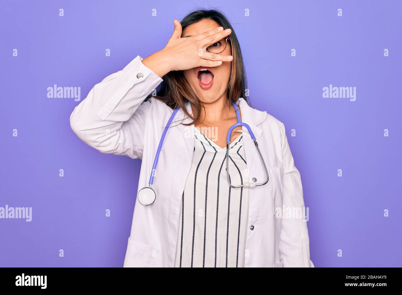 Professional doctor woman wearing stethoscope and medical coat over ...