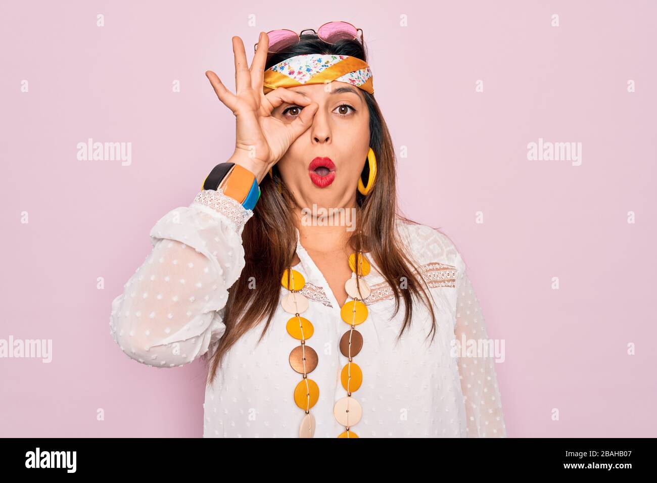Young hispanic hippie woman wearing fashion boho style and sunglasses ...