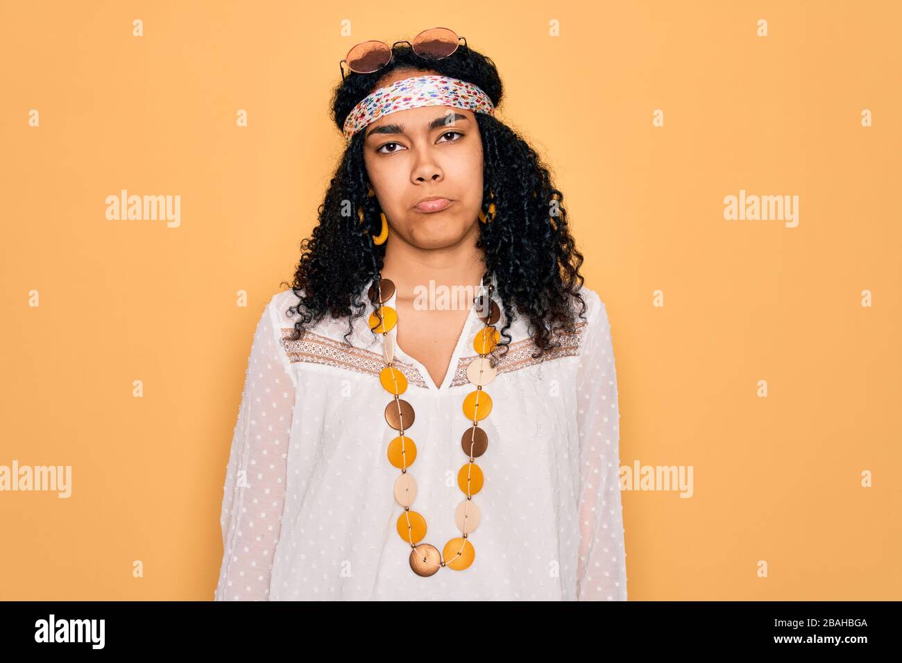 Young african american curly hippie woman wearing sunglasses and ...