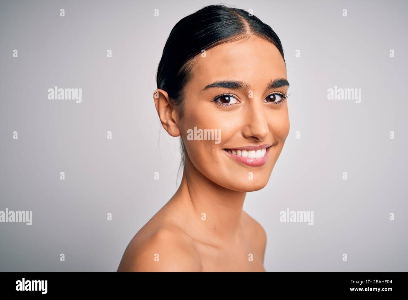 Close up of young beautiful woman with clear and pure skin. Perfect and ...