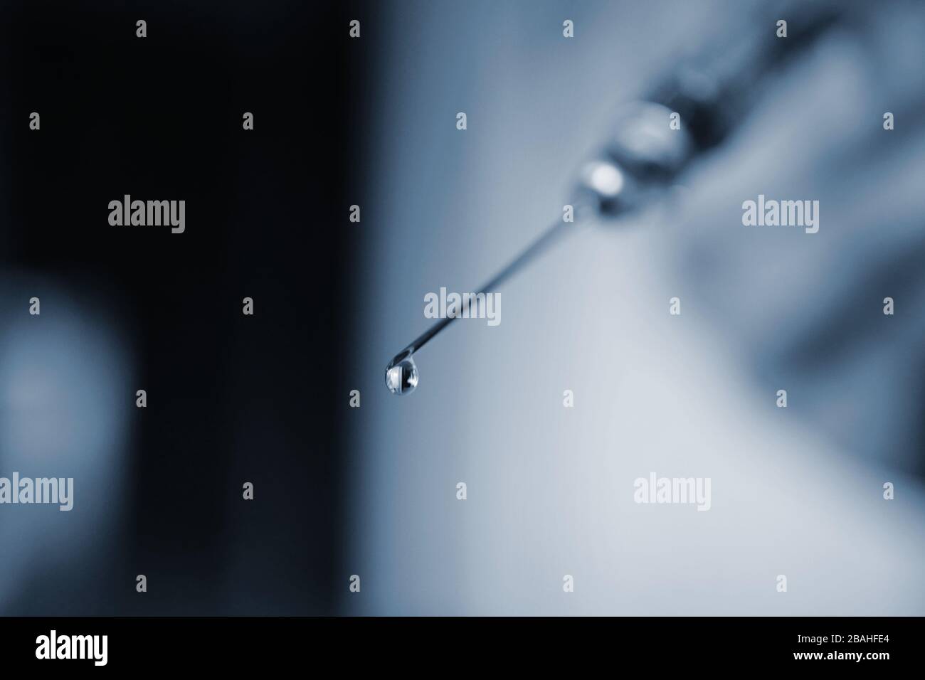 syringe with a drop of medicine, macro photo Stock Photo - Alamy