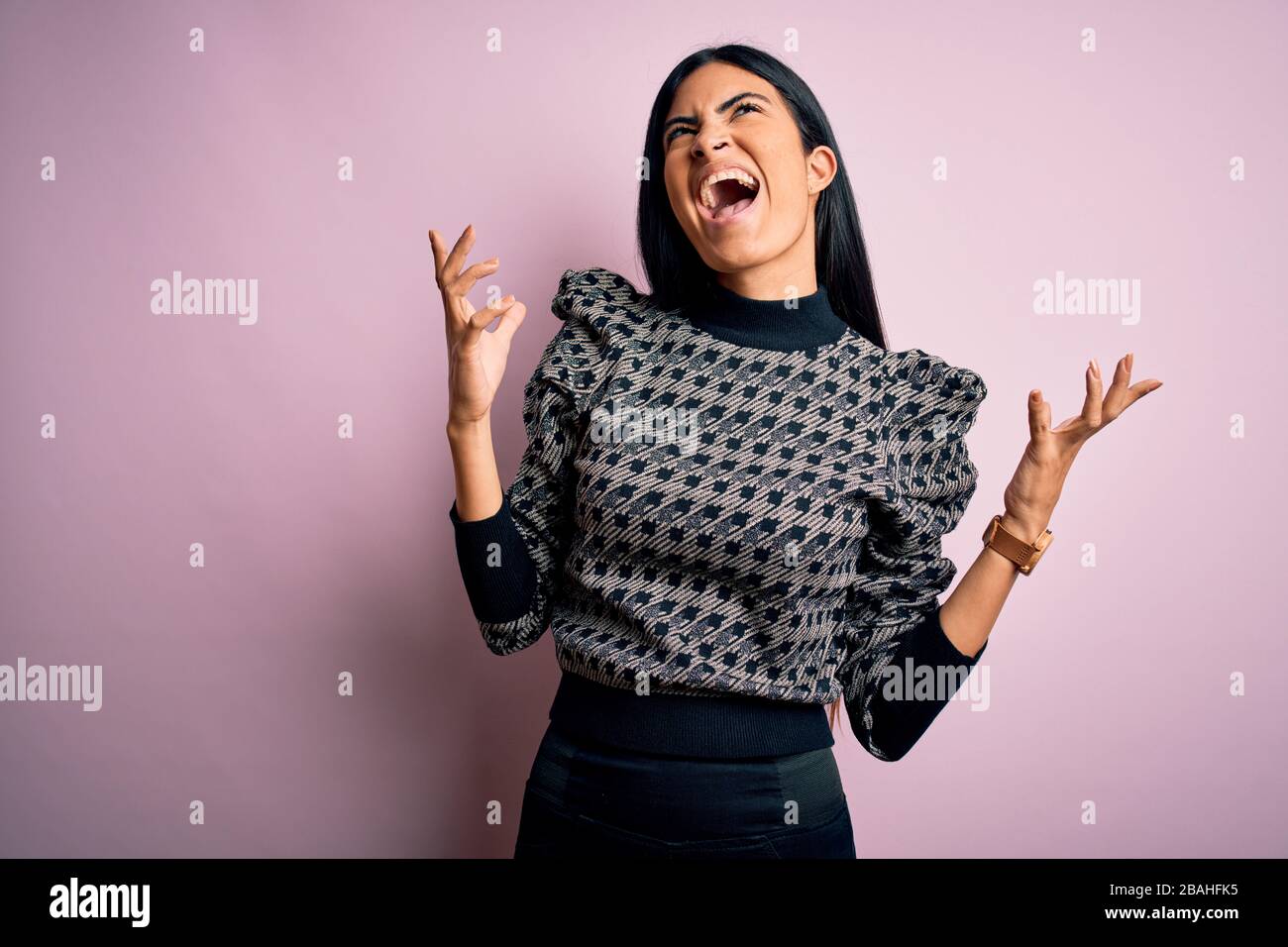 Young beautiful hispanic business woman wearing elegant sweater over ...