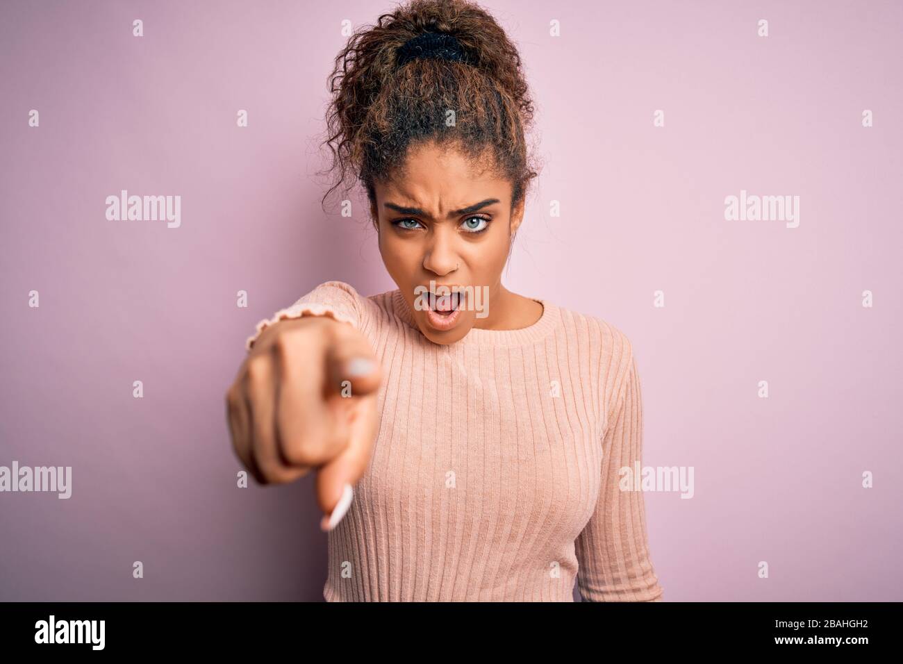 Young beautiful african american girl wearing casual sweater standing ...