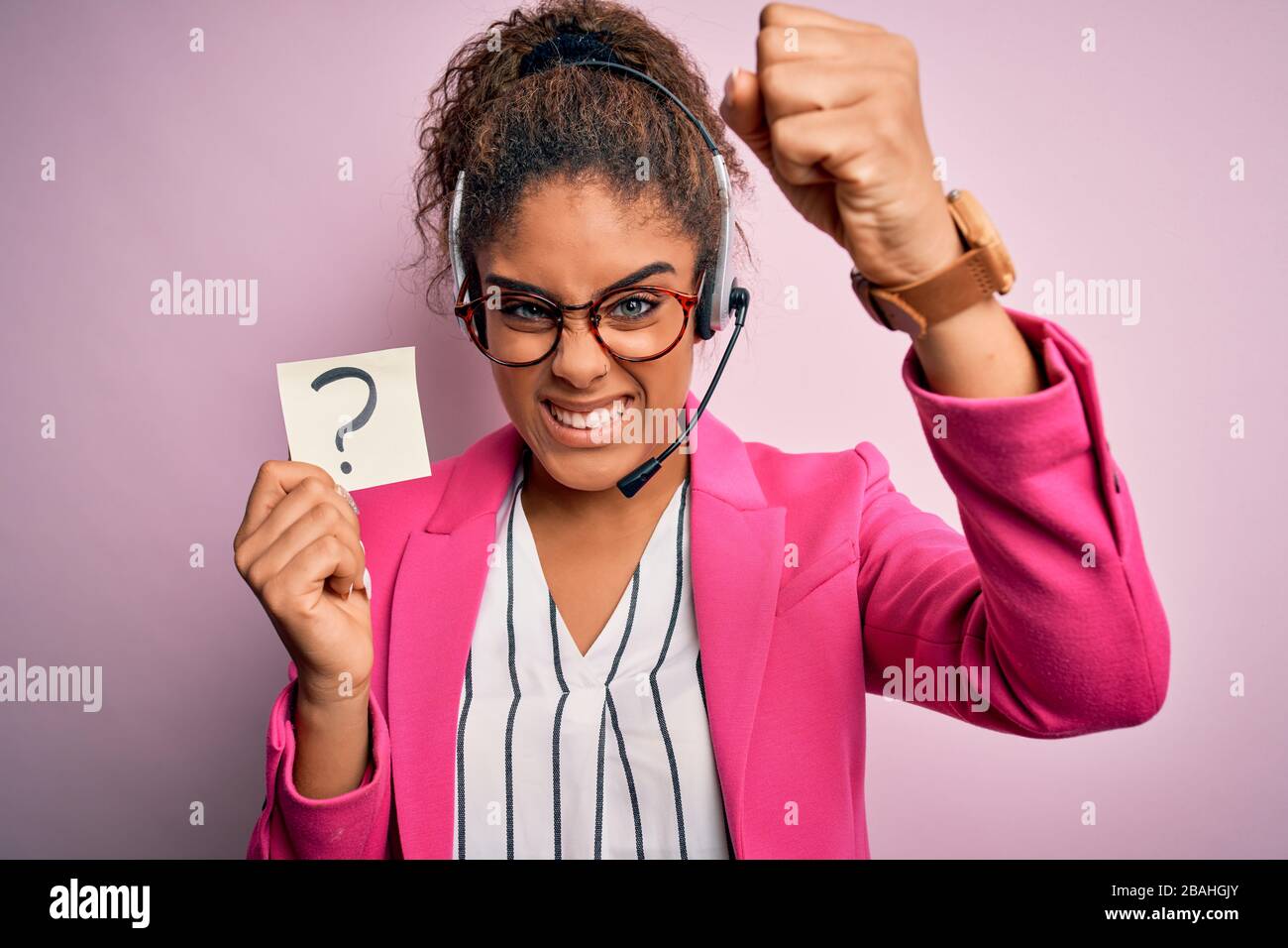 African american call center agent girl working using headset holding ...