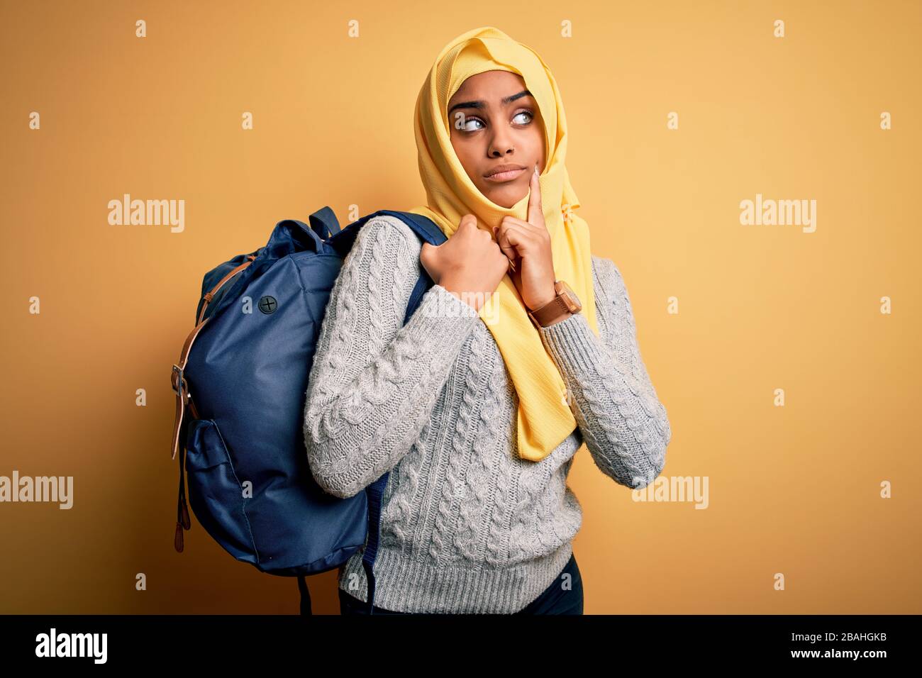Young african american student girl wearing muslim hijab and backpack ...