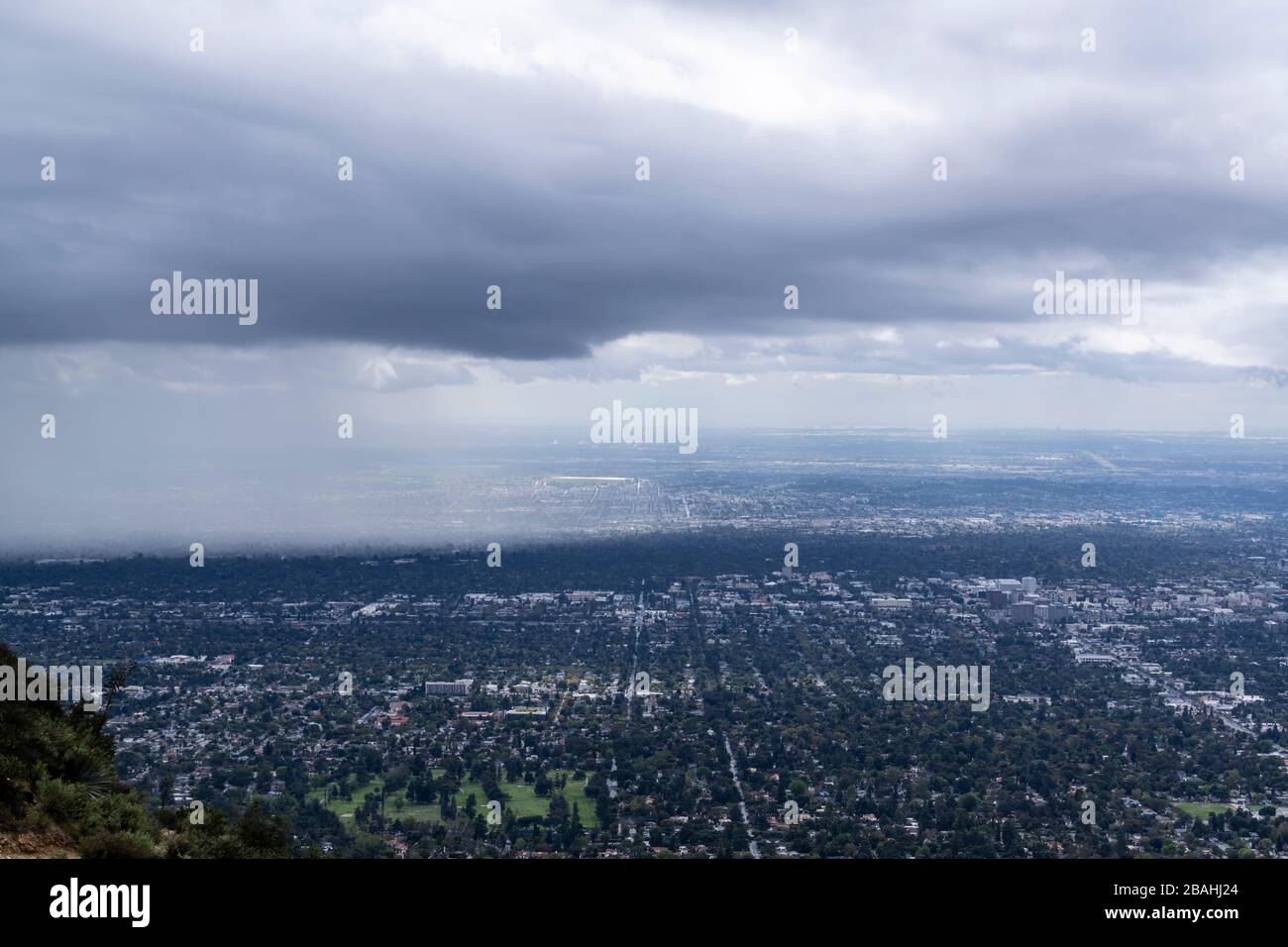 Mountaintop view of storm clouds and rain moving into Pasadena in Los ...