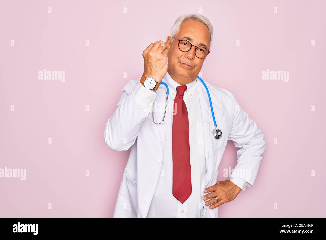Middle age senior grey-haired doctor man wearing stethoscope and ...