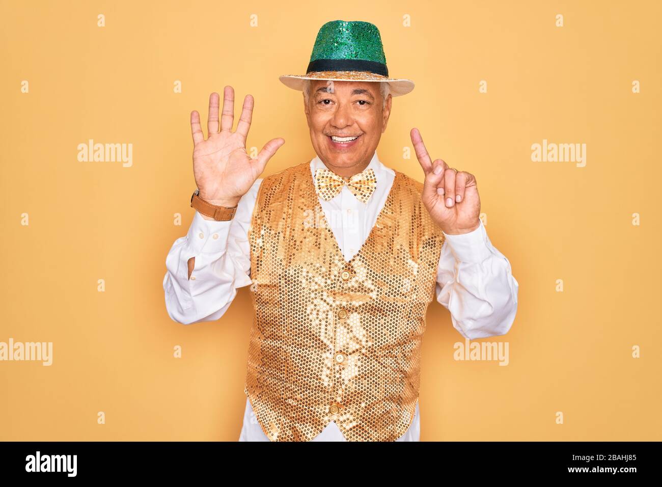 Middle age senior grey-haired man wearing Brazilian carnival custome ...