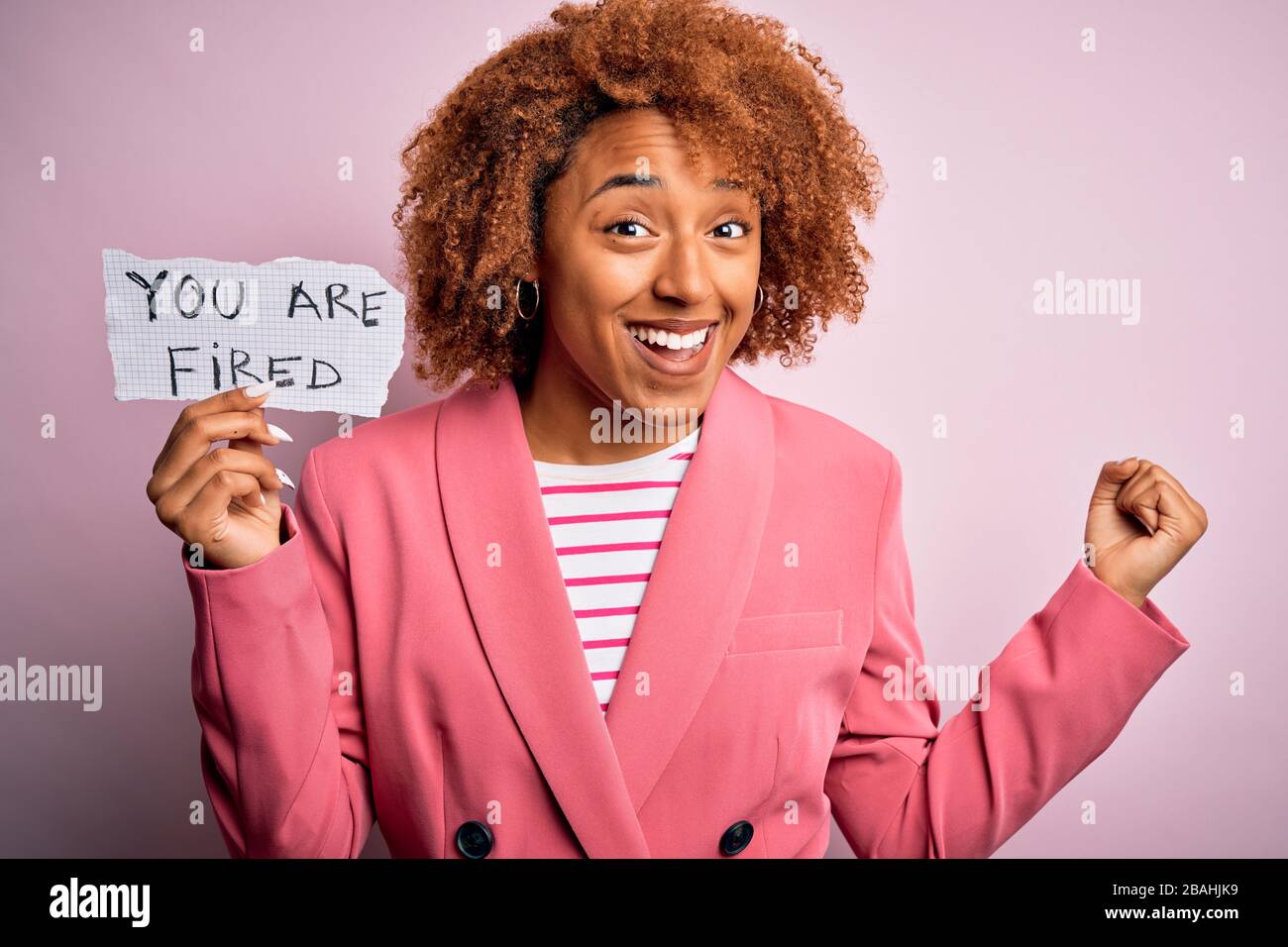 Young African American afro woman with curly hair holding papaer with ...