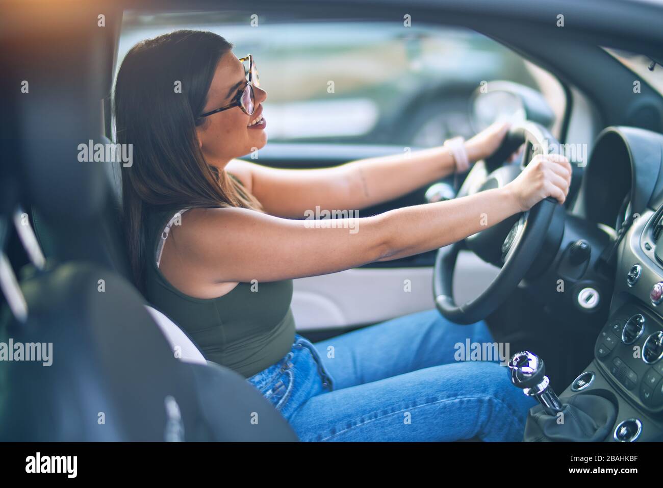 Young beautiful woman smiling happy and confident. Sitting with smile ...