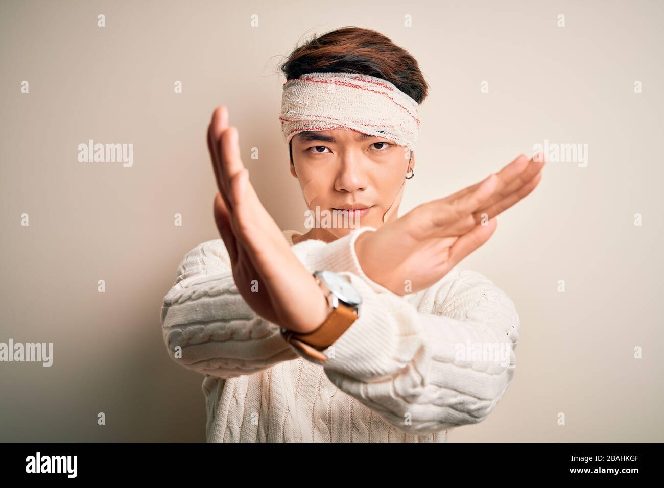 Young handsome chinese man injured for accident wearing bandage and ...
