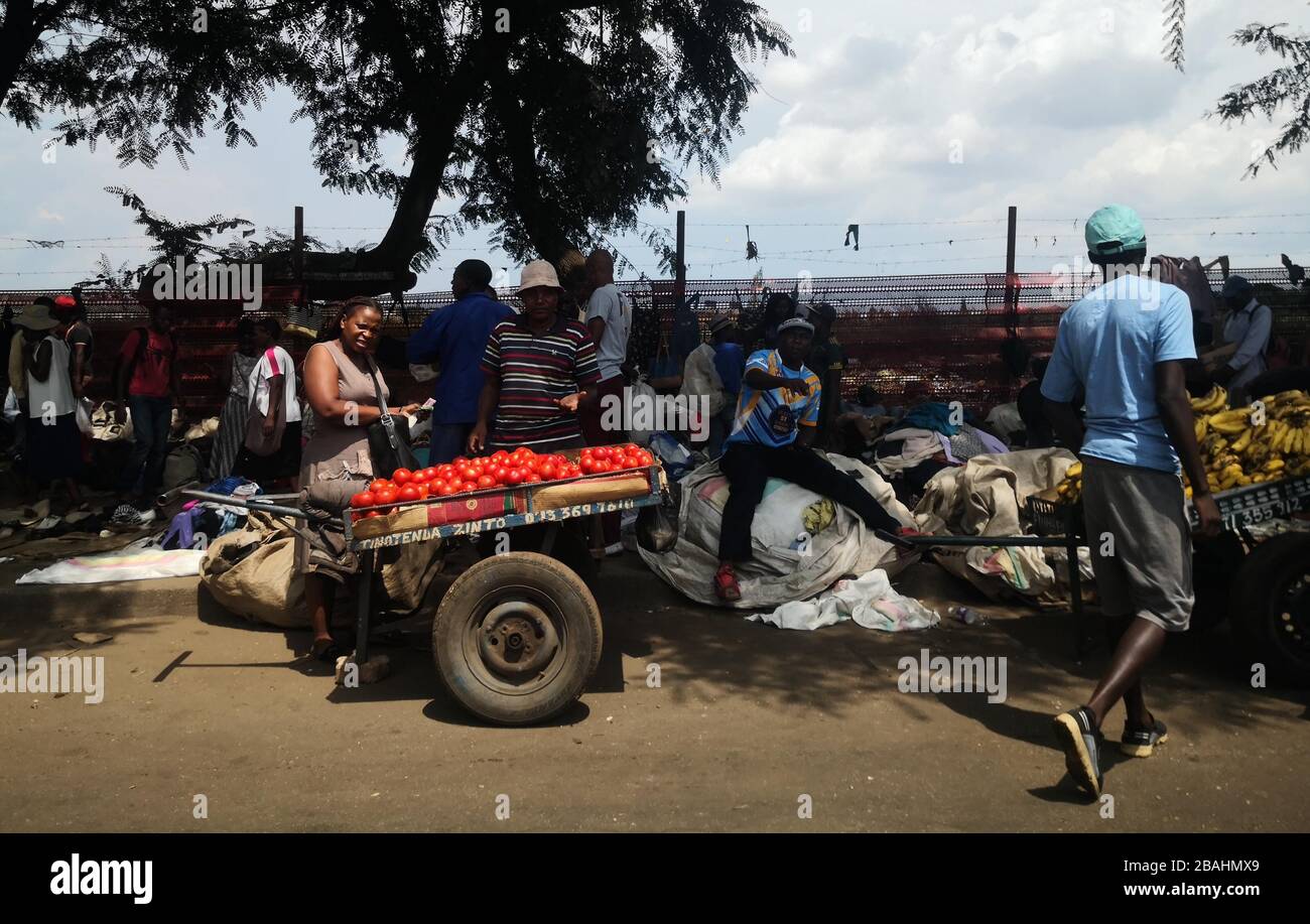 Harare, Zimbabwe. 27th Mar, 2020. Locals buy basic commodities at a ...