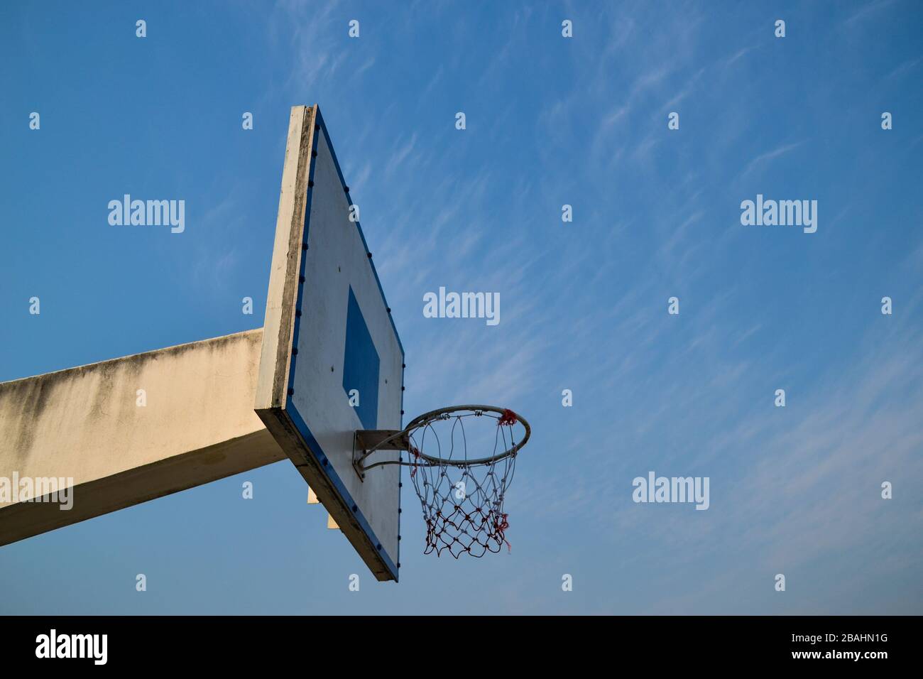 Basketball hoop on blue sky background Stock Photo - Alamy