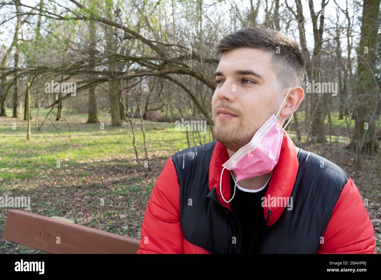 Portrait of a healthy man take off medical mask. Coronavirus concept ...