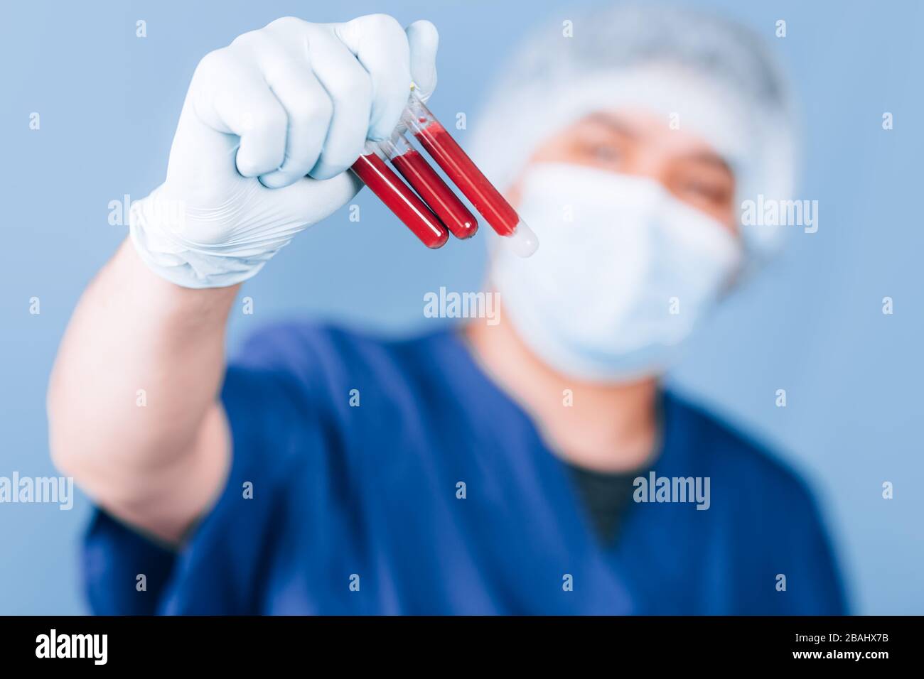 doctor holding test tube Stock Photo - Alamy