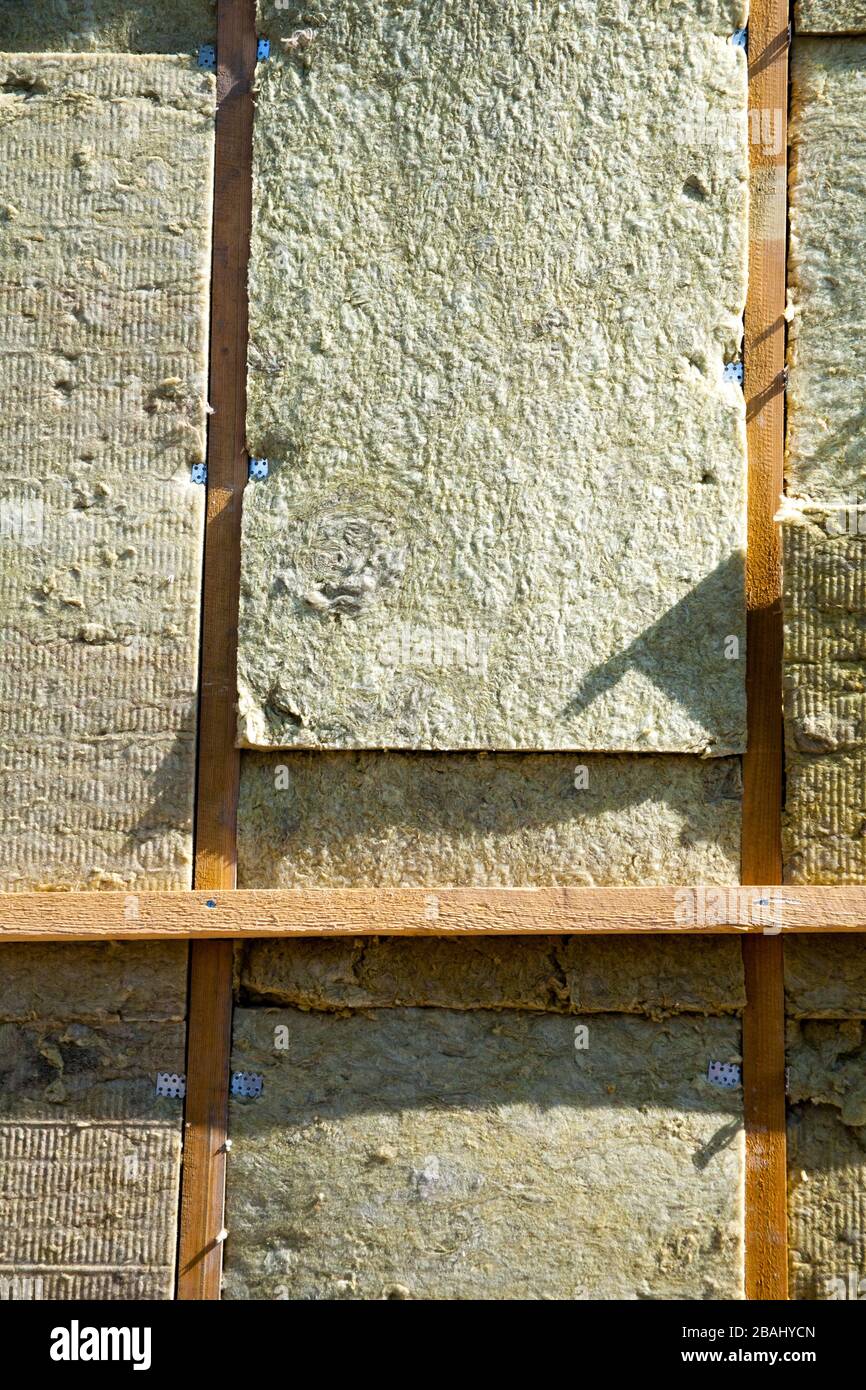 warming the walls of a stone house with a stone wool heater. Ecological ...