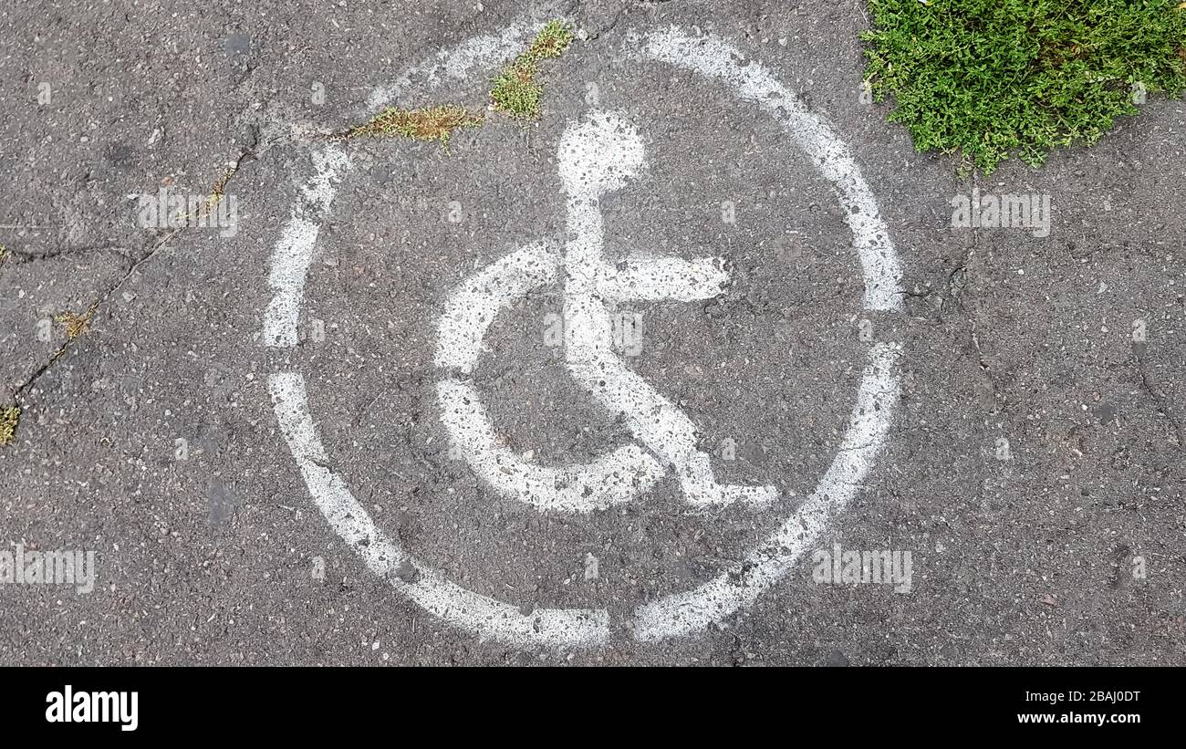 Disabled parking symbol. Disabled bay marked with a person in a ...