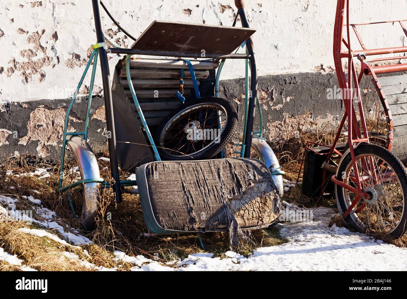 two very worn carriages that are used in horse racing Stock Photo - Alamy