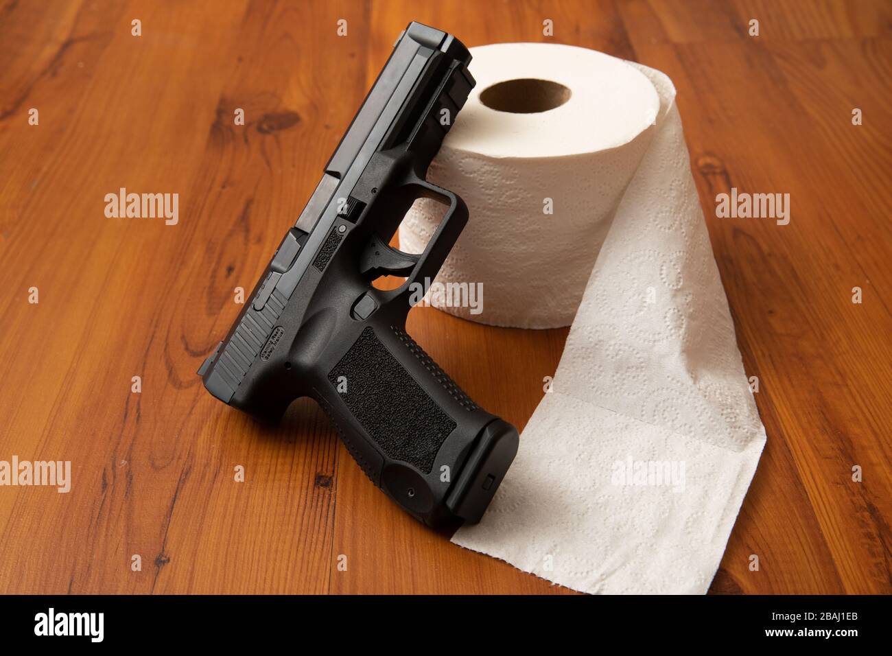 Gun to try and keep the toilet paper safe Stock Photo - Alamy