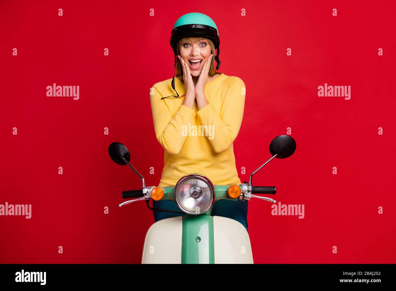 Portrait of amazed crazy funky girl moped rider impressed by incredible ...