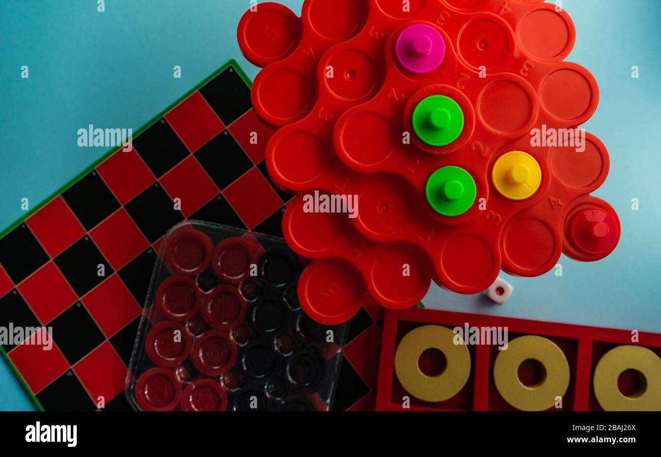 COVID-19 virus concept with board games on pastel background with copy ...