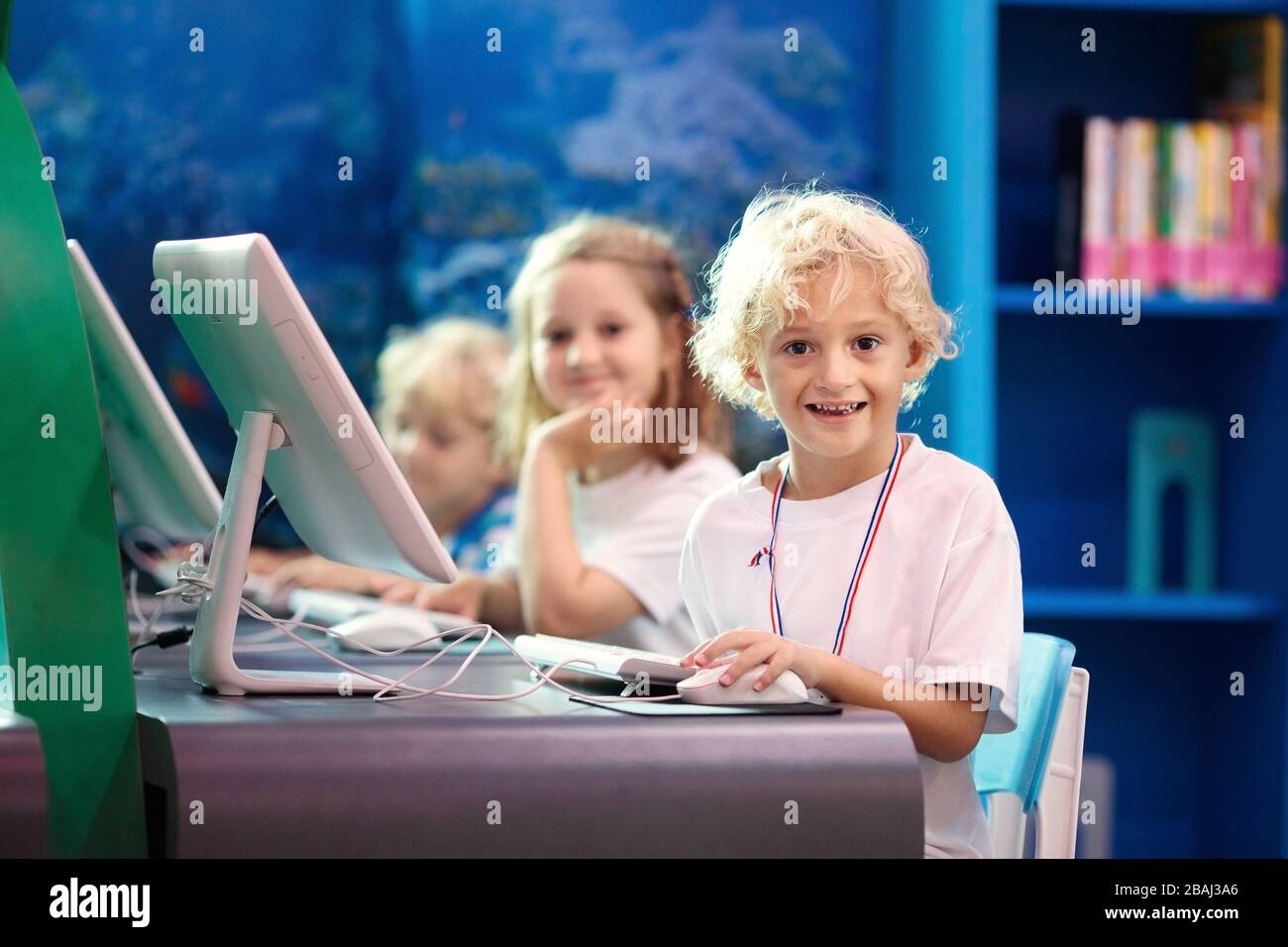 Boy school typing children hi-res stock photography and images - Alamy