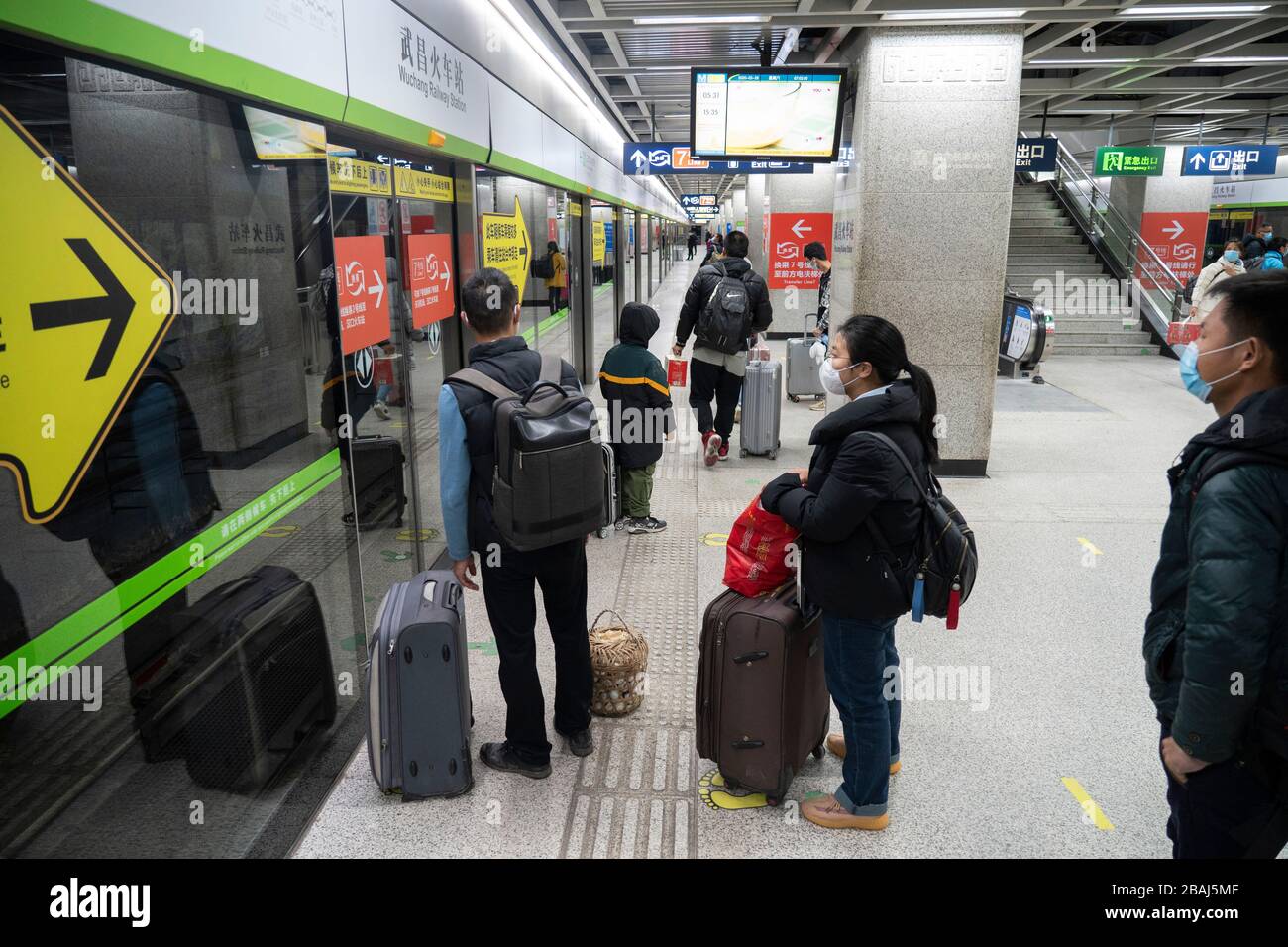Wuhan, China's Hubei Province. 28th Mar, 2020. Passengers line up to ...