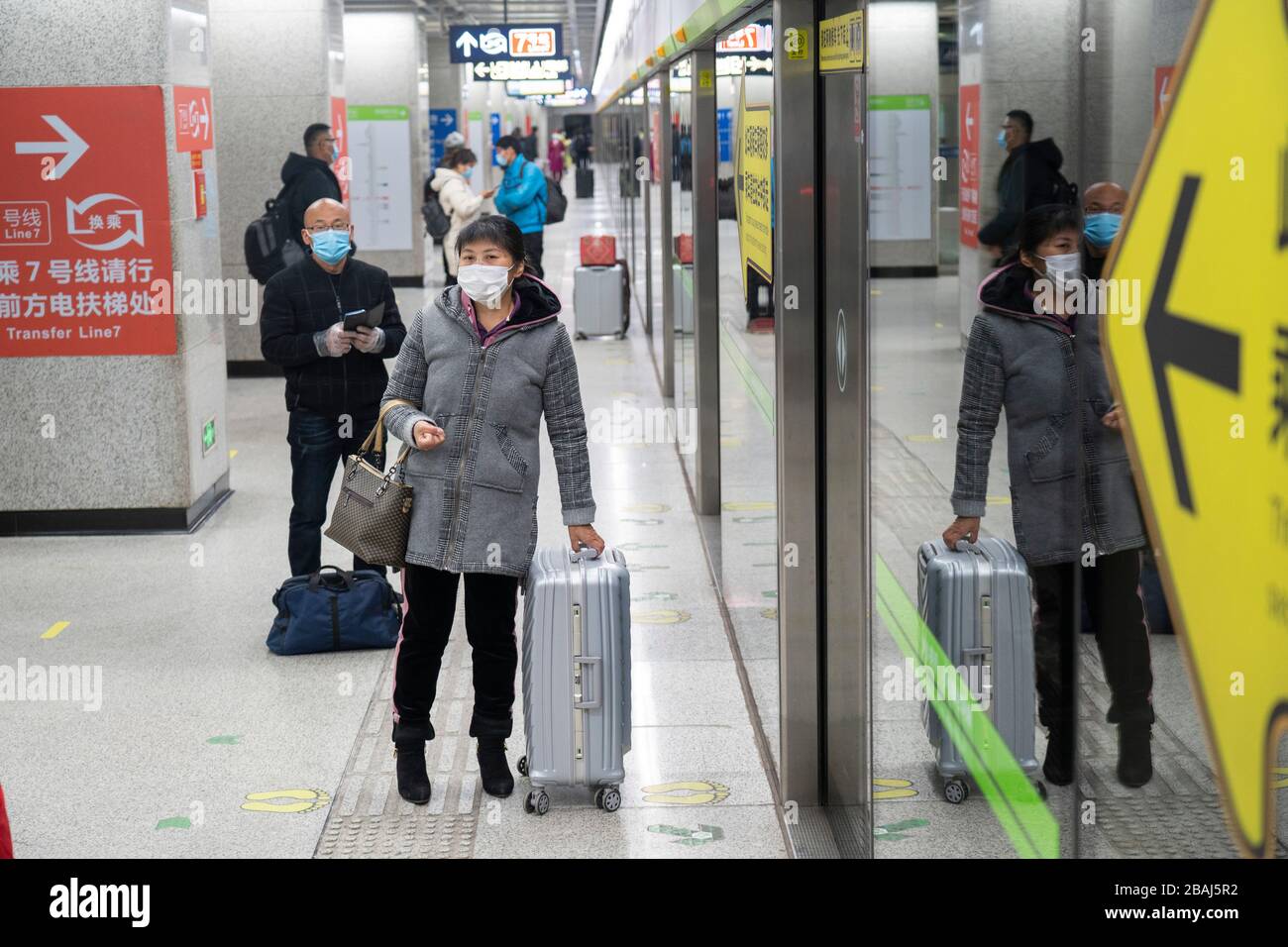 Wuhan, China's Hubei Province. 28th Mar, 2020. Passengers wait to get ...